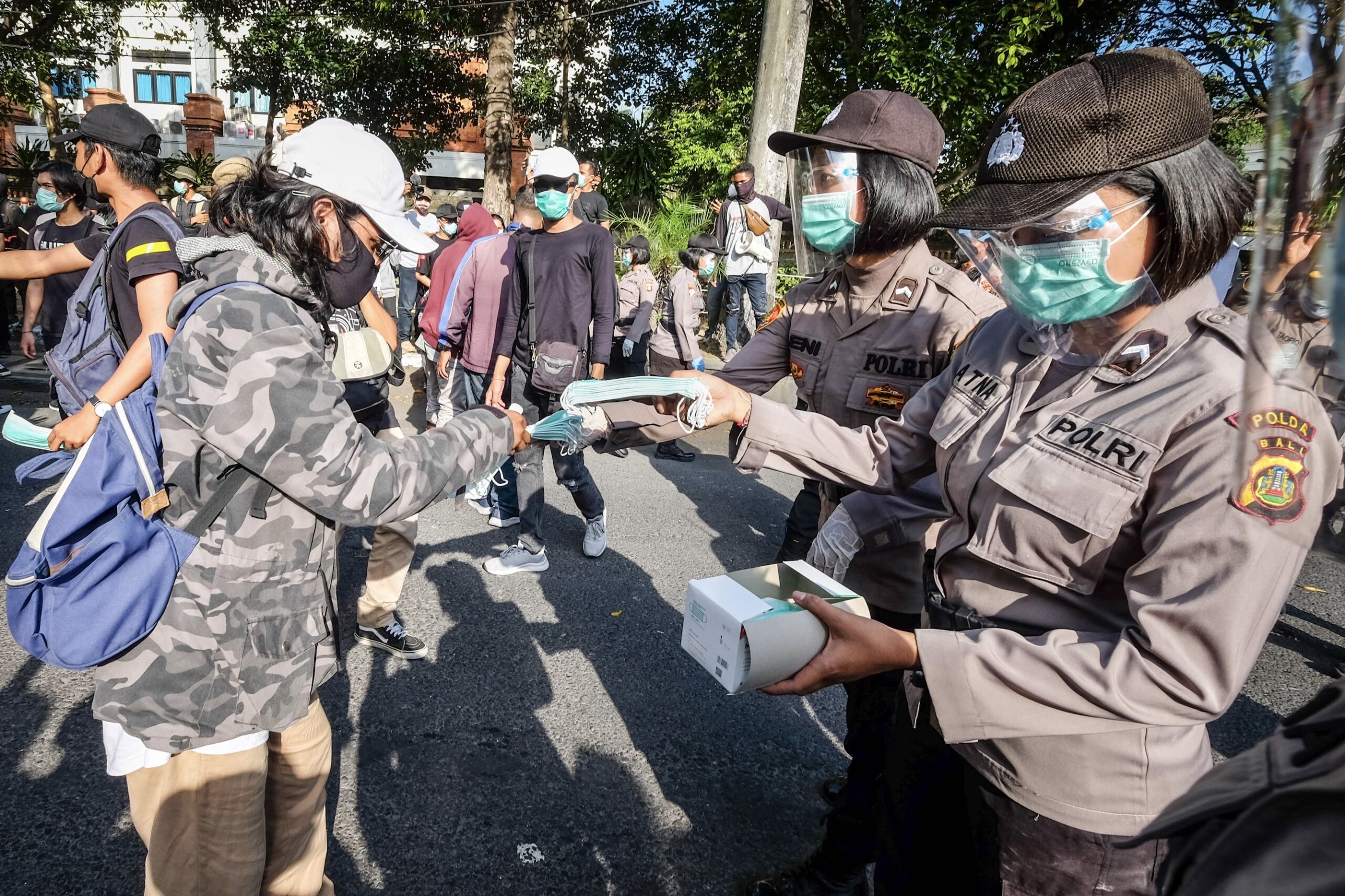 Bali Police Distribute Free Food and Masks During Patrol Operation ...